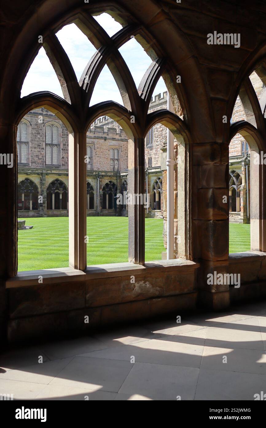 The play of light and shadows cast by arched windows in the inner ...