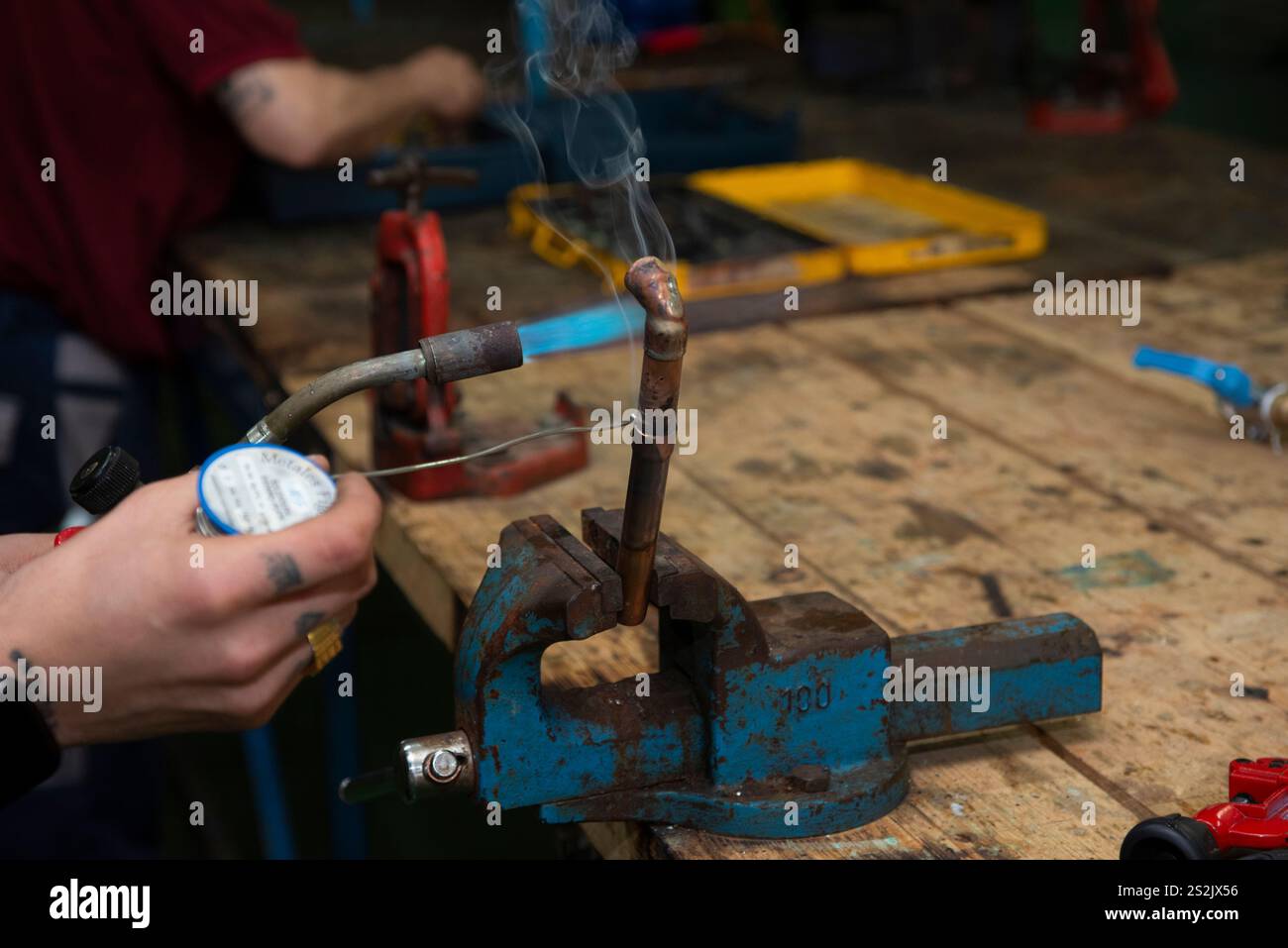Tin and lead soldering tools on a workbench Stock Photo - Alamy