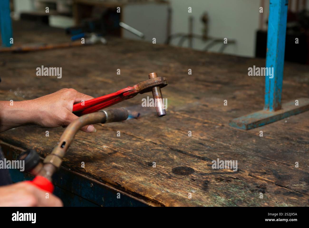 Tin and lead soldering tools on a workbench Stock Photo - Alamy