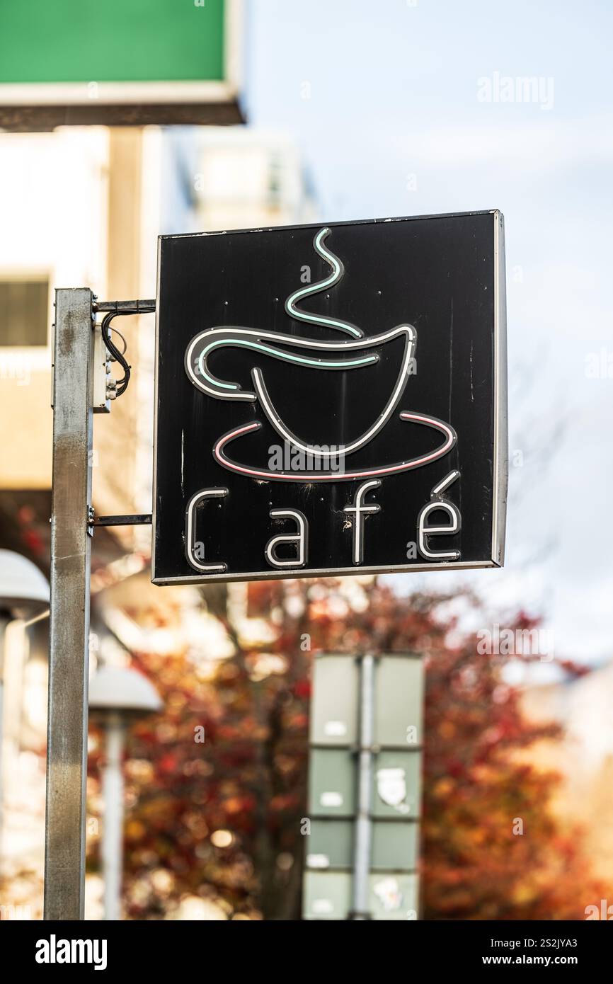 Neon cafe sign on a pole Stock Photo - Alamy