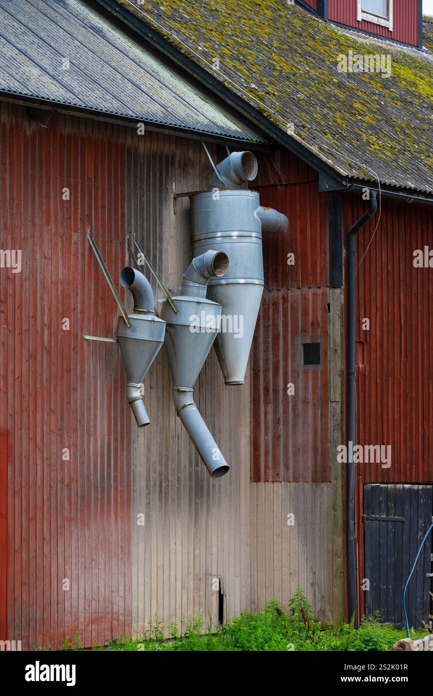 Metal cyclone separators mounted on a barn wall Stock Photo - Alamy