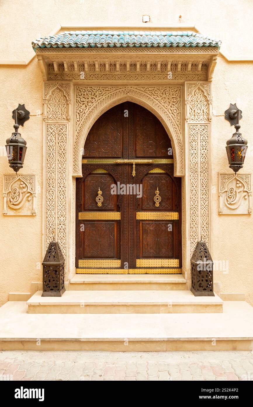 Arched door a riad in the Medina of Marrakesh, Morocco. The intricate ...
