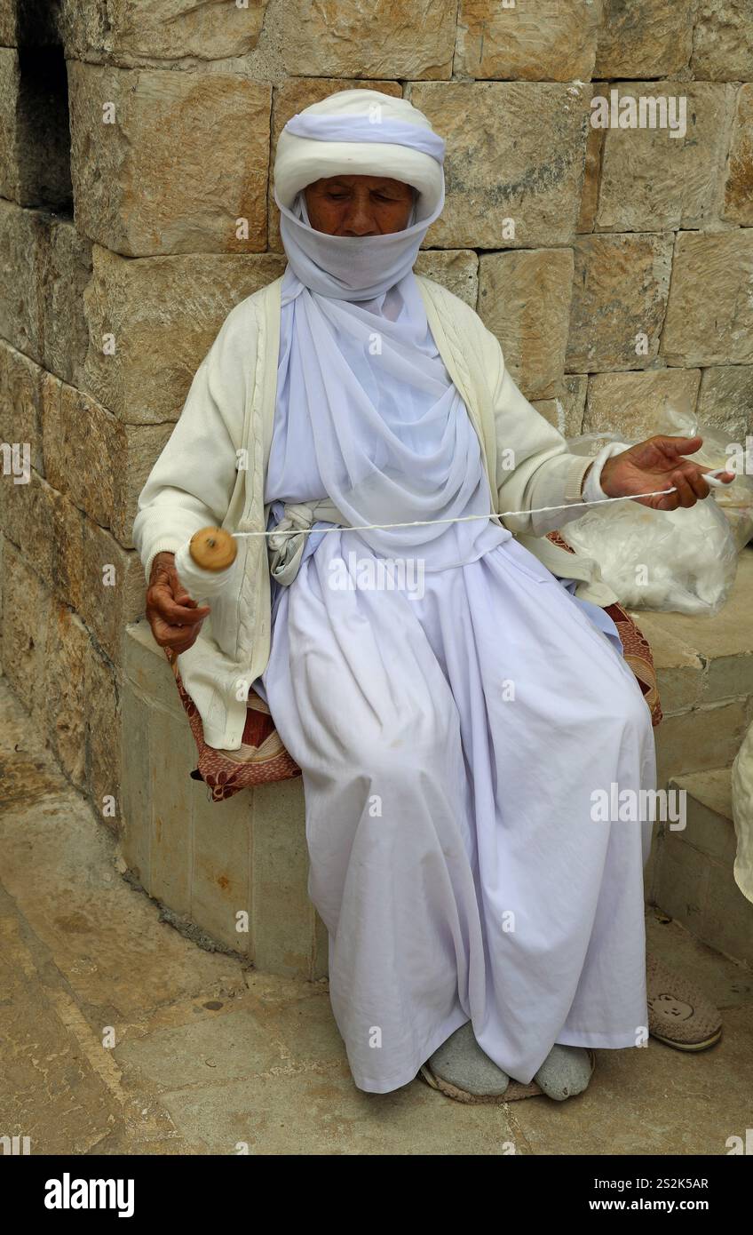 Woman with distaff hi-res stock photography and images - Alamy