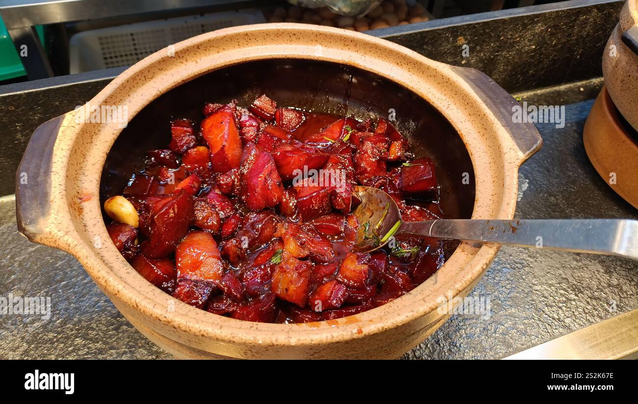 Chinese style pork, bacon cooked with dark sauce Stock Photo - Alamy