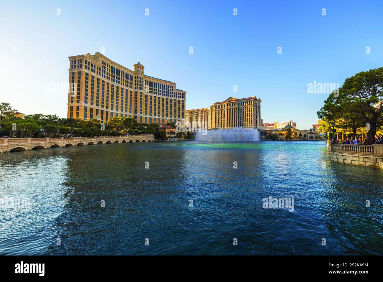 Bellagio Hotel and Caesars Palace reflecting on calm water with ...