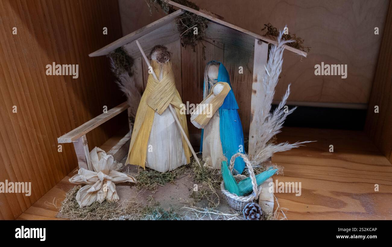 A handcrafted nativity scene made of natural straw materials, featuring ...