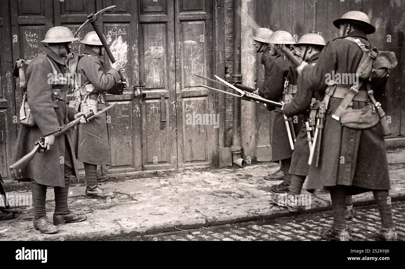 During the Irish War of Independence, British soldiers force open the ...