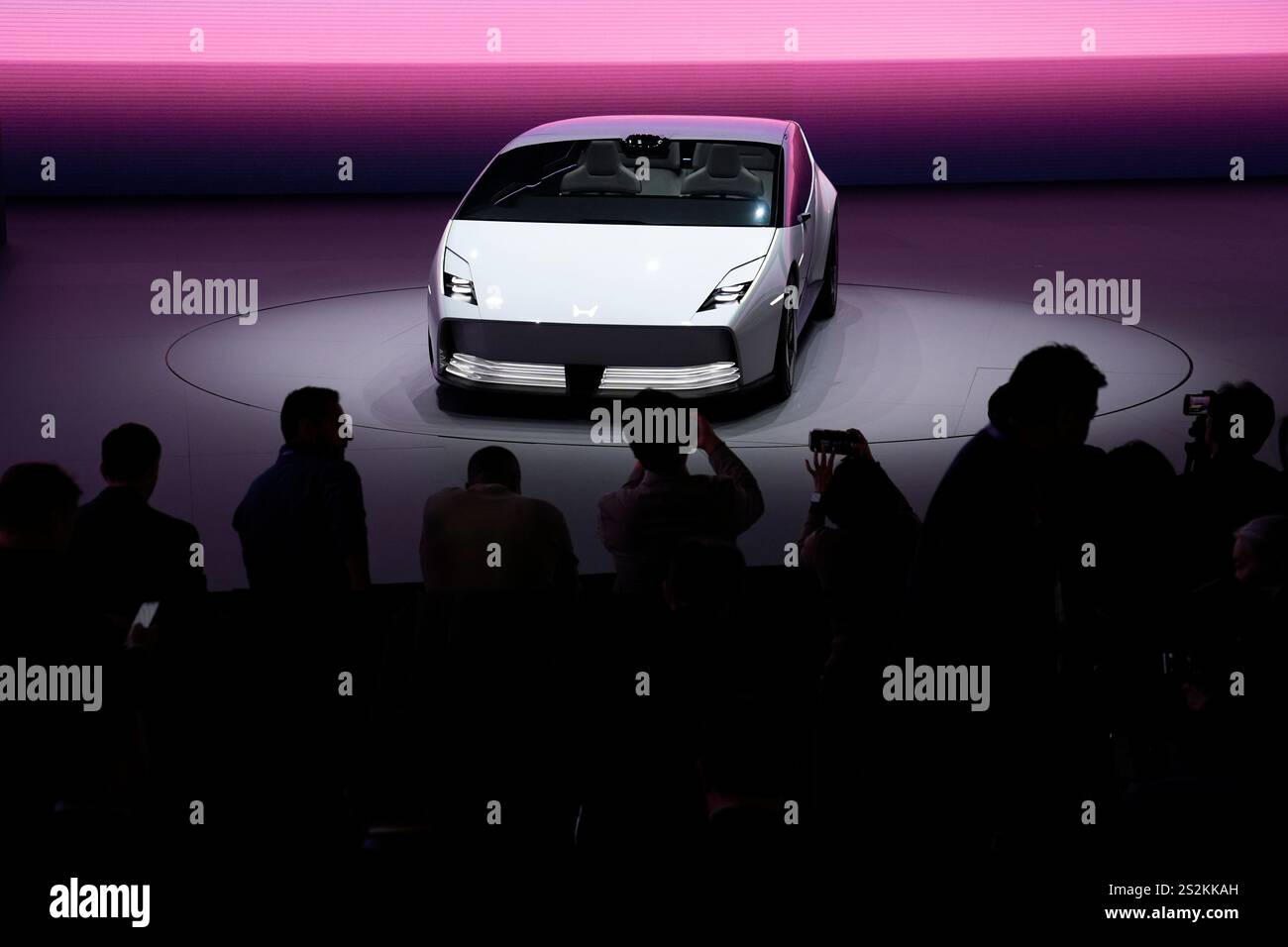 People view the Honda 0 Saloon EV prototype at the Honda booth during ...