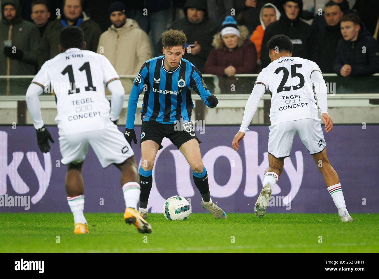 Brugge, Belgium. 07th Jan, 2025. OHL's Ignace Konan N'Dri, Club's Maxim ...