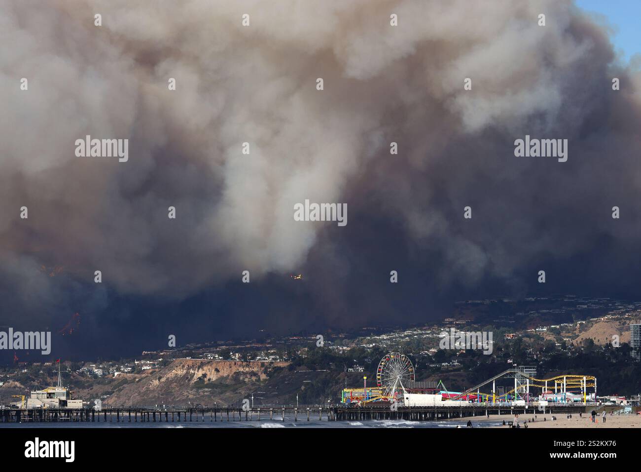 Los Angeles, California, USA. 7th Jan, 2025. A wildfire burns in the ...