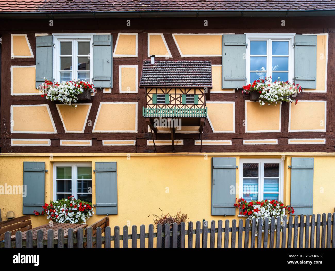 A charming half-timbered medieval house in Dinkelsbuhl, Germany, with a ...