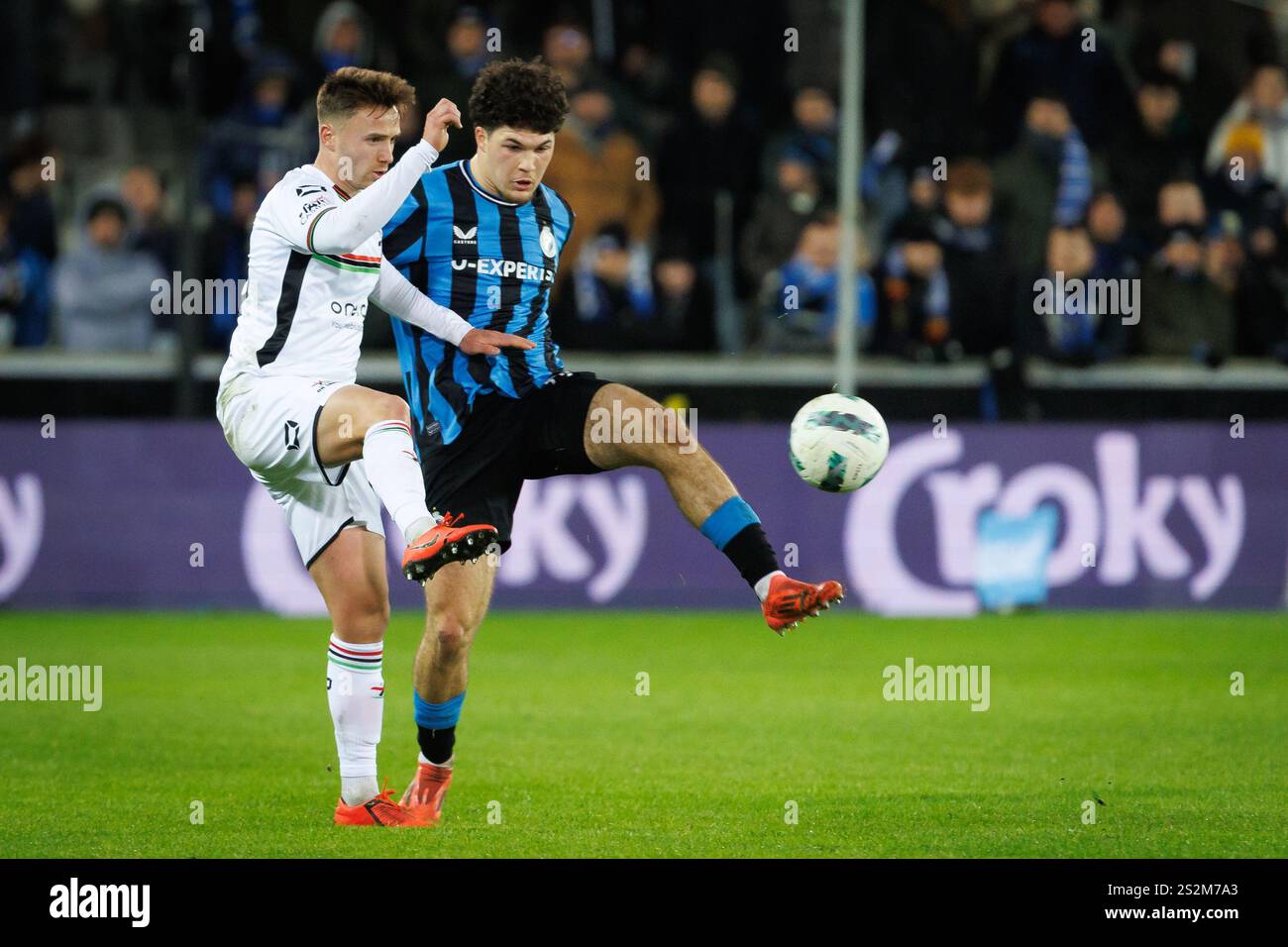 Brugge, Belgium. 07th Jan, 2025. OHL's Wouter George and Club's Kyriani ...