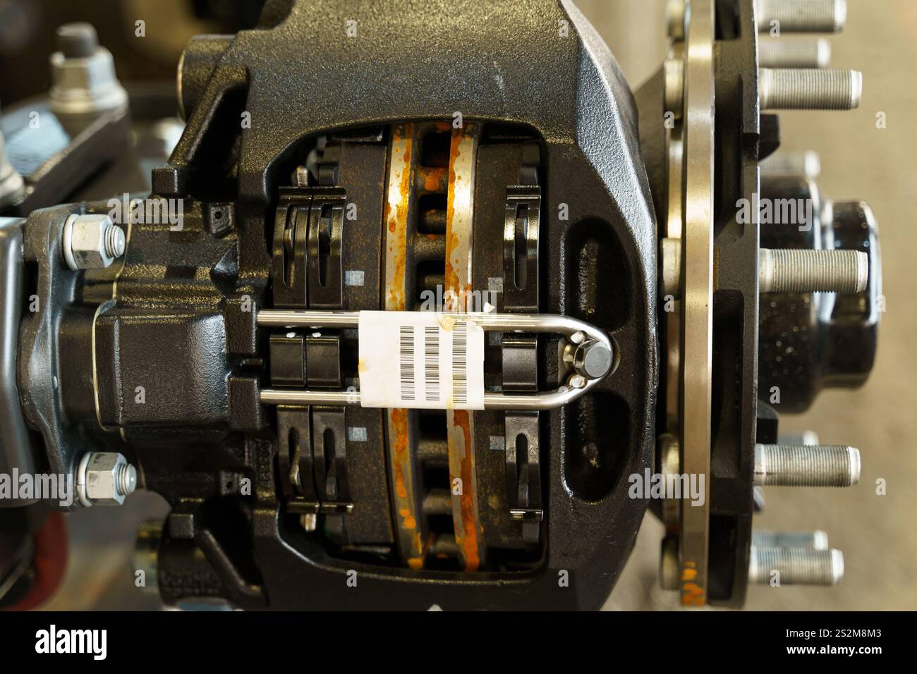 A detailed close-up of a brake system reveals the complex assembly and ...