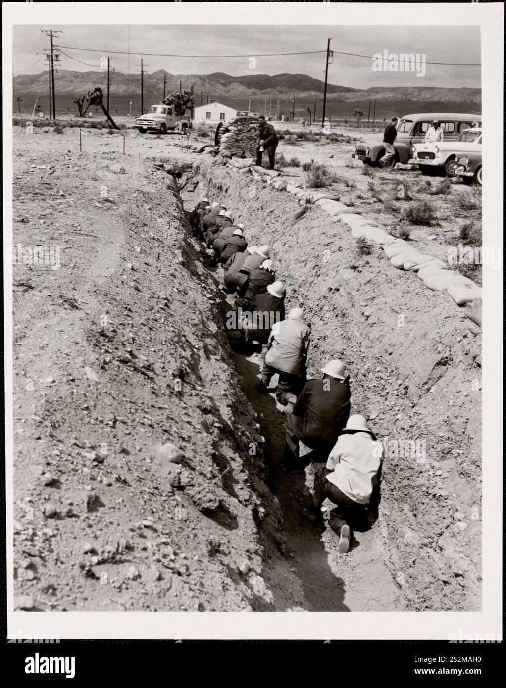 Field exercise participants in trench, Welfare photos of Operation Cue ...