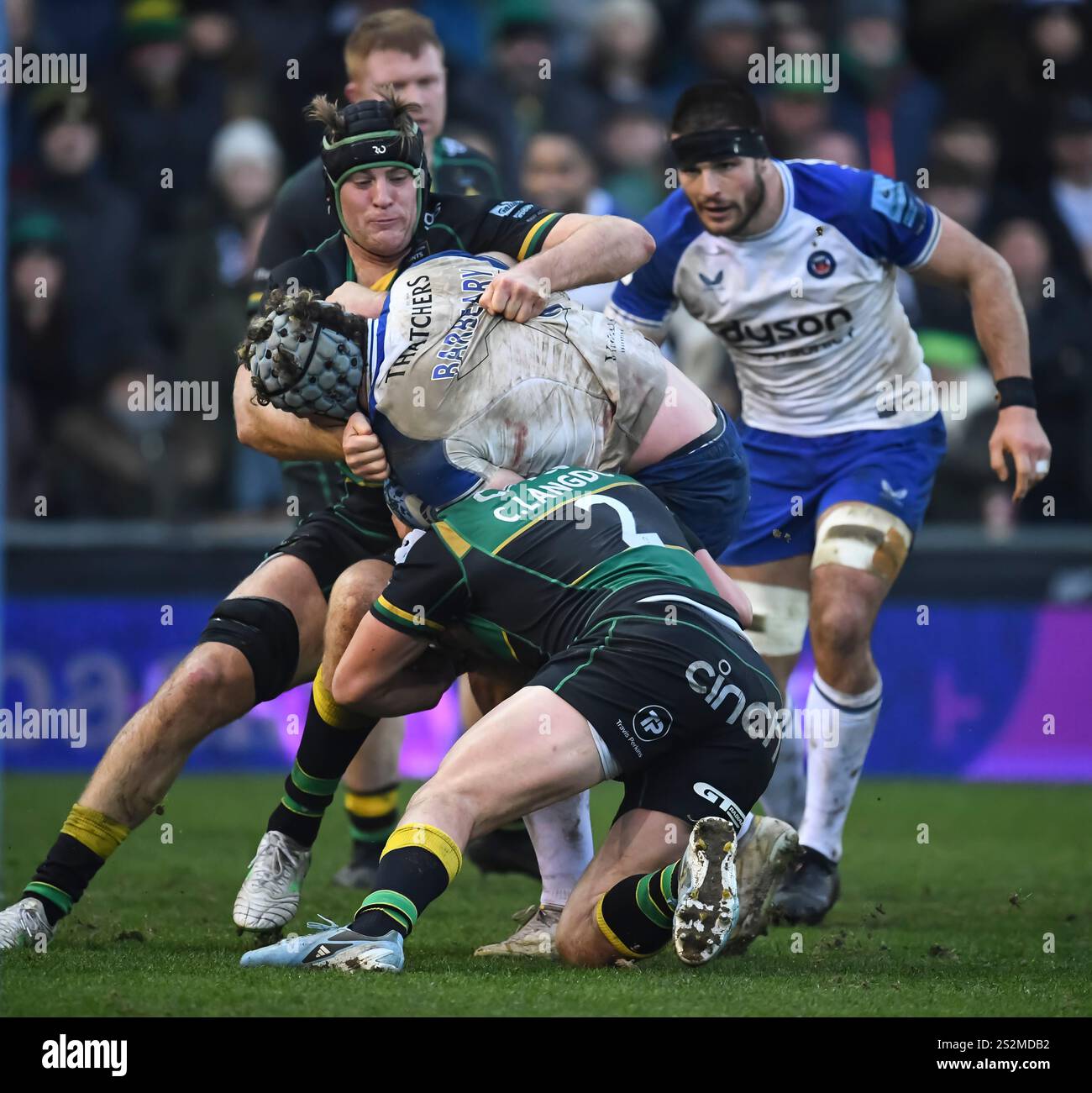 Alex Coles and Curtis Langdon of Northampton Saints tackle Alfie ...