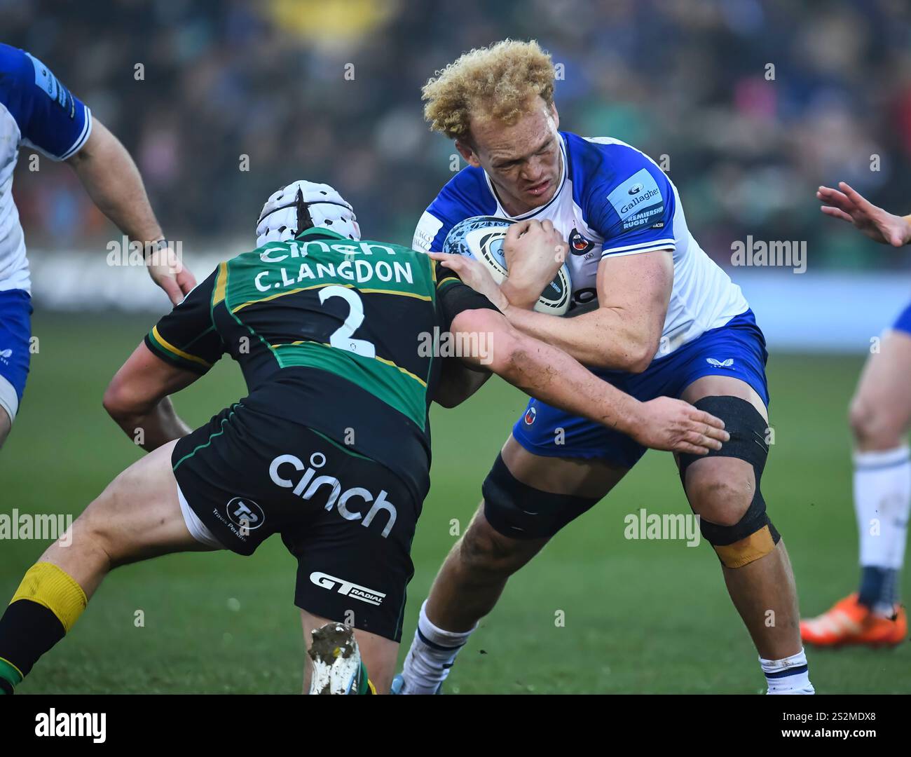 Alex Mitchell of Northampton Saints and Miles Reid of Bath Rugby in ...