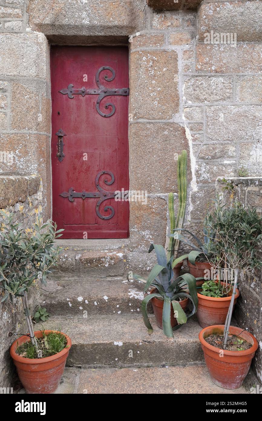 175 Mont-Saint-Michel: Old red painted, studded wood door of a XIV ...