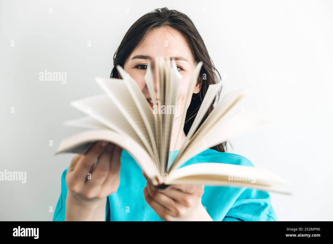 Flipping book pages in slow hi-res stock photography and images - Alamy