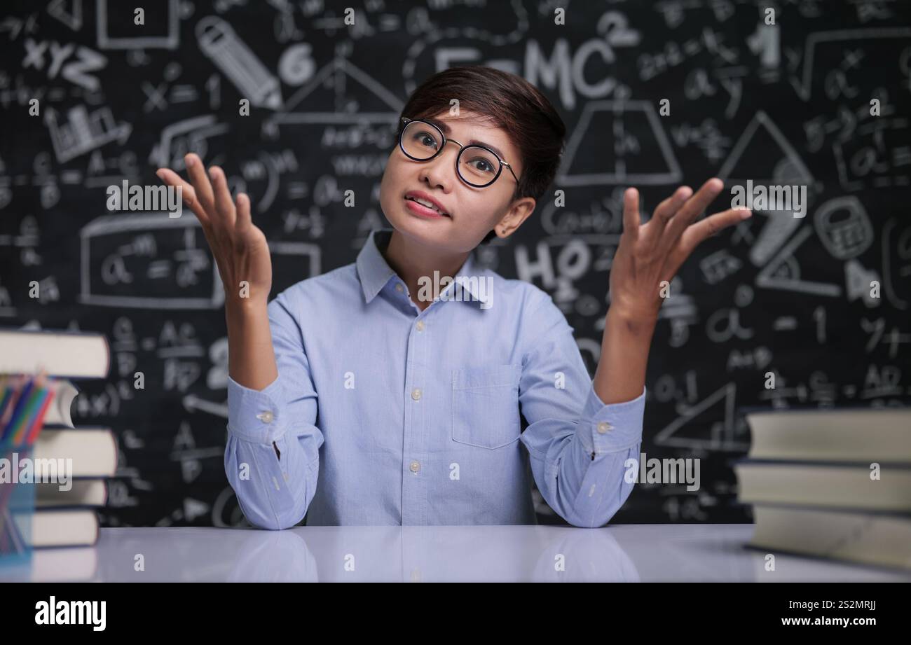 The teacher sat thinking about teaching in the classroom Stock Photo ...