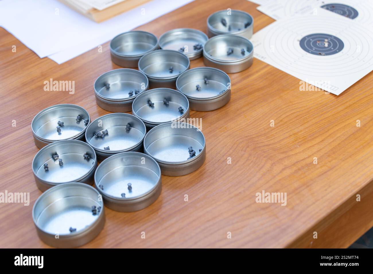 Metal air rifle ammunition in round metal boxes in a shooting ...