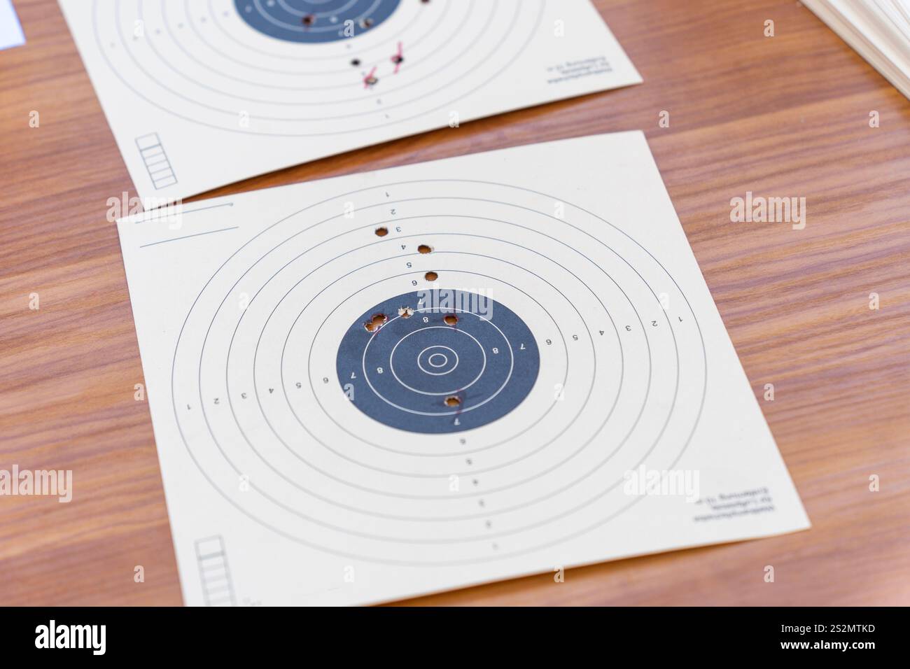 Paper target sheets with bullet marks Stock Photo - Alamy