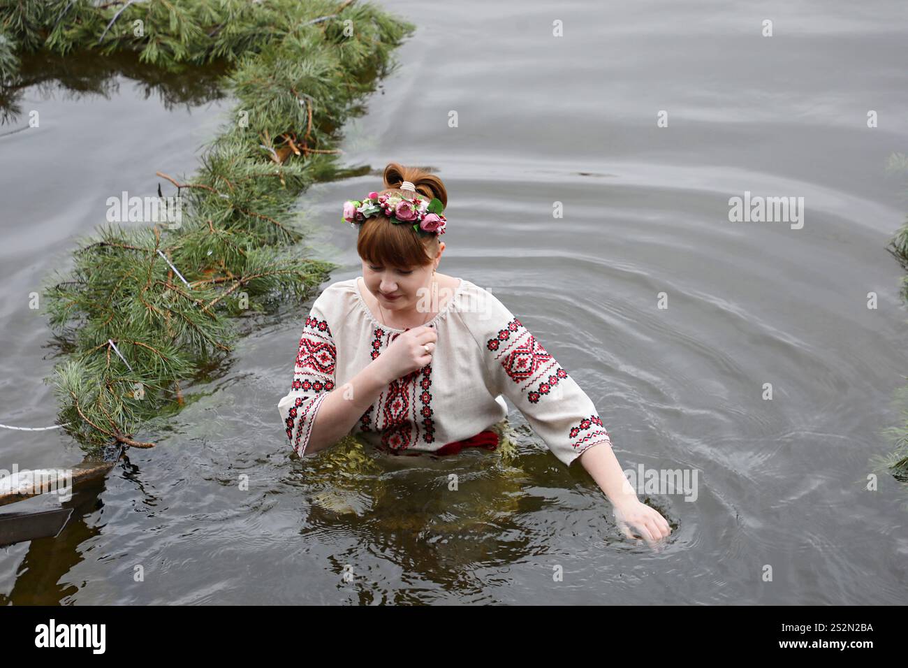 KYIV, UKRAINE - JANUARY 6, 2025 - A woman in an embroidered shirtdress ...