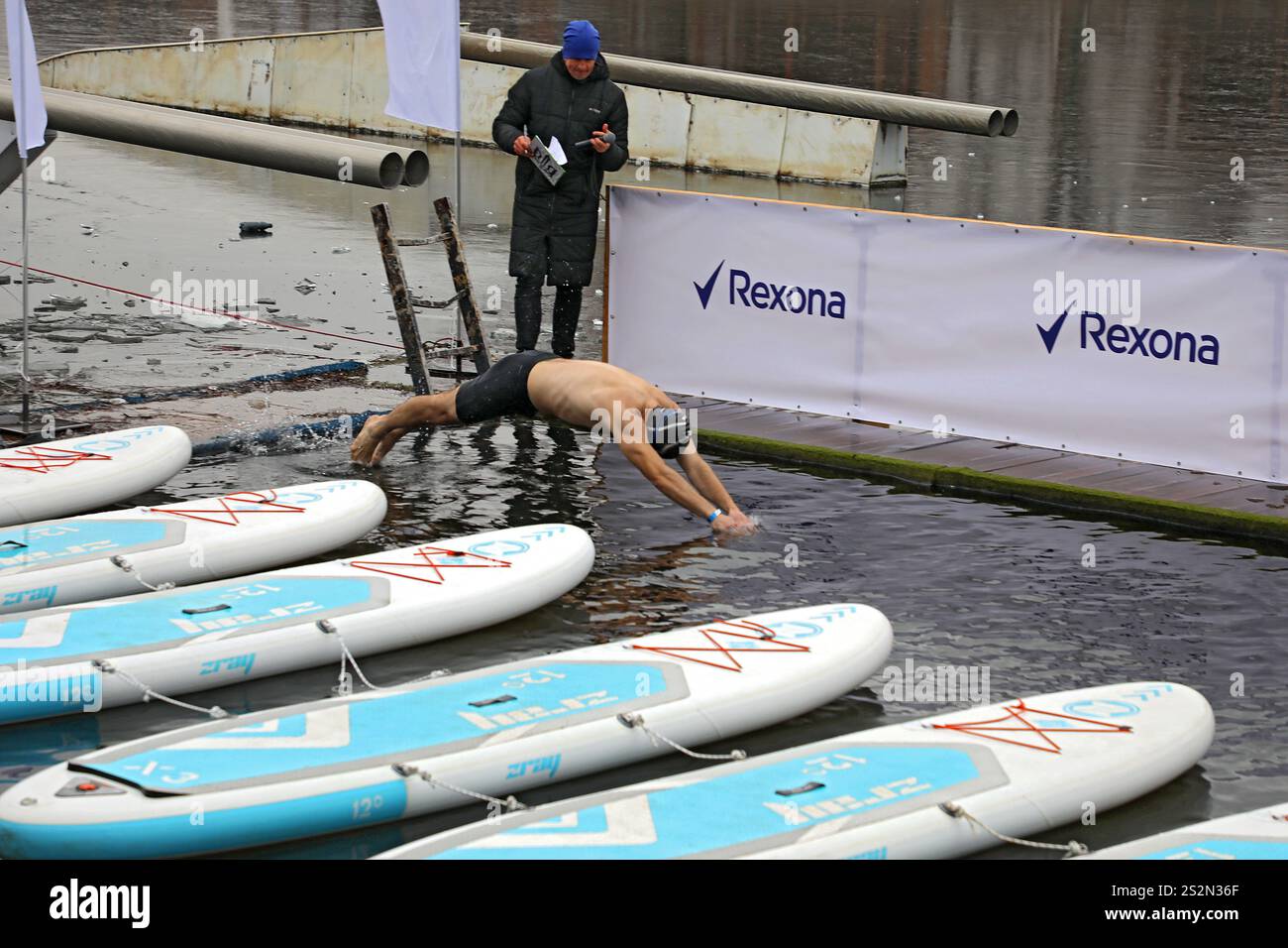 KYIV, UKRAINE - JANUARY 6, 2025 - A man dives during a winter swimming ...