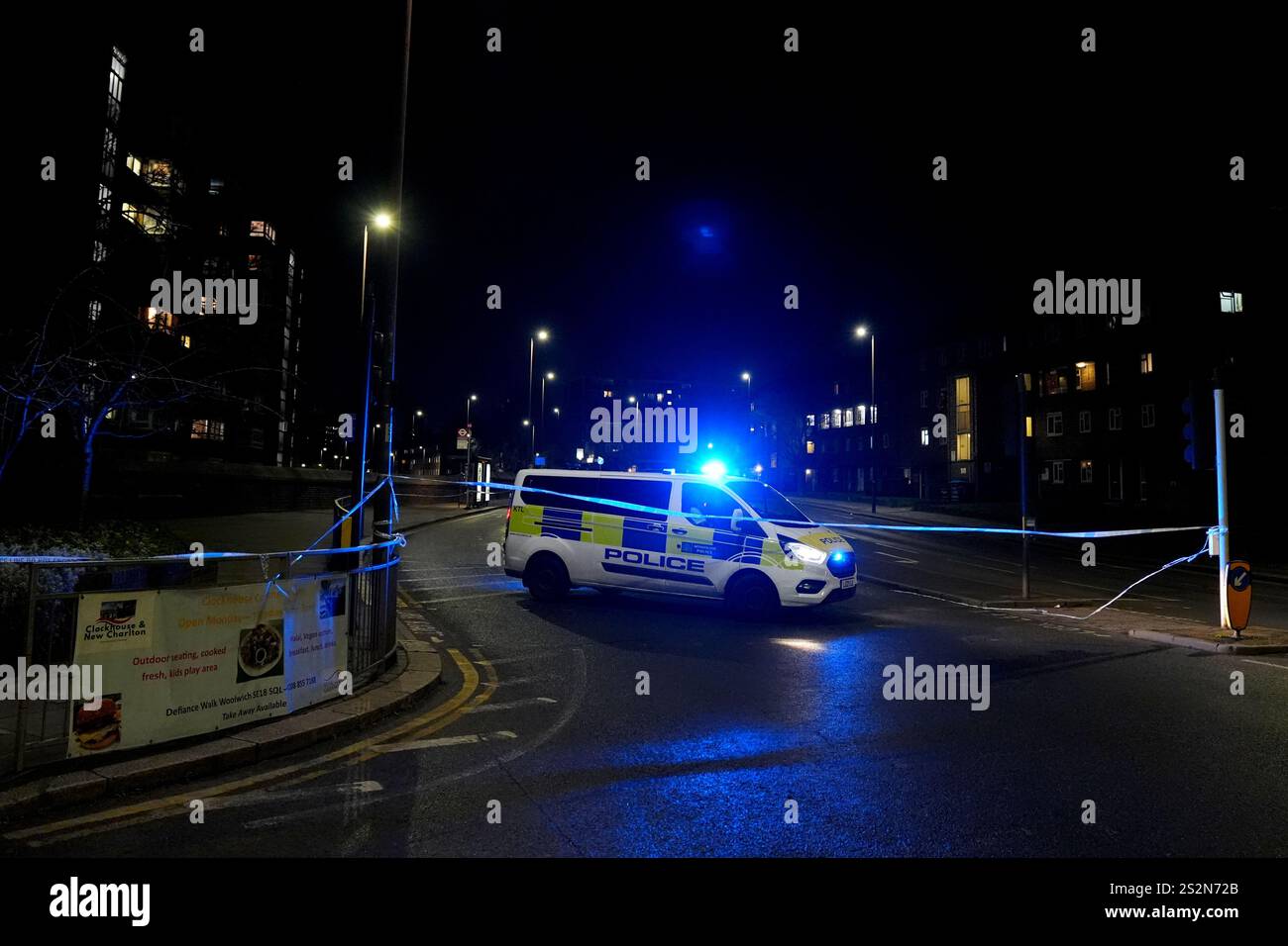 A police van behind a police cordon, at the scene in Woolwich, south ...