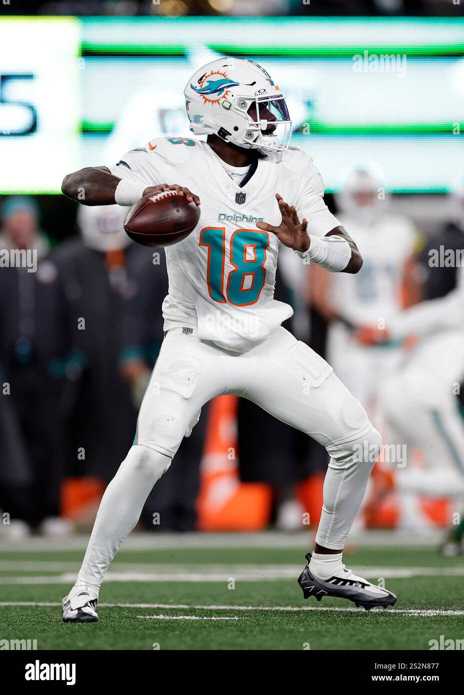 Miami Dolphins quarterback Tyler Huntley (18) looks to pass the ball ...