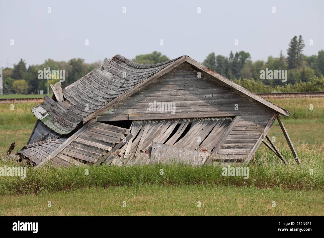 rustic abandoned rural farm building propped up on boards Stock Photo ...