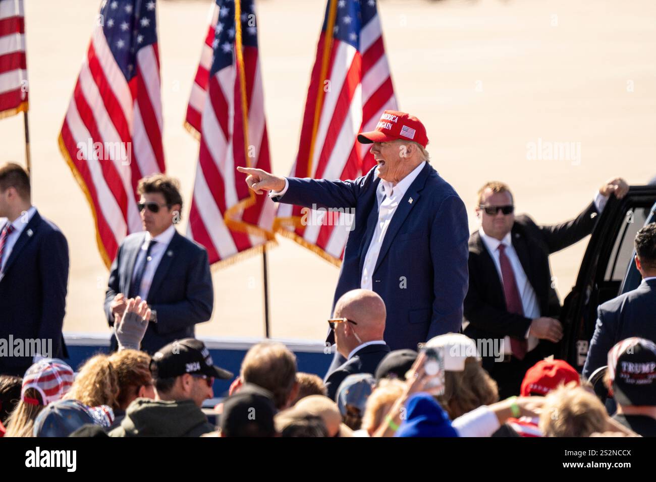 Donald Trump points at the crowd at an outdoor rally in Wisconsin ...