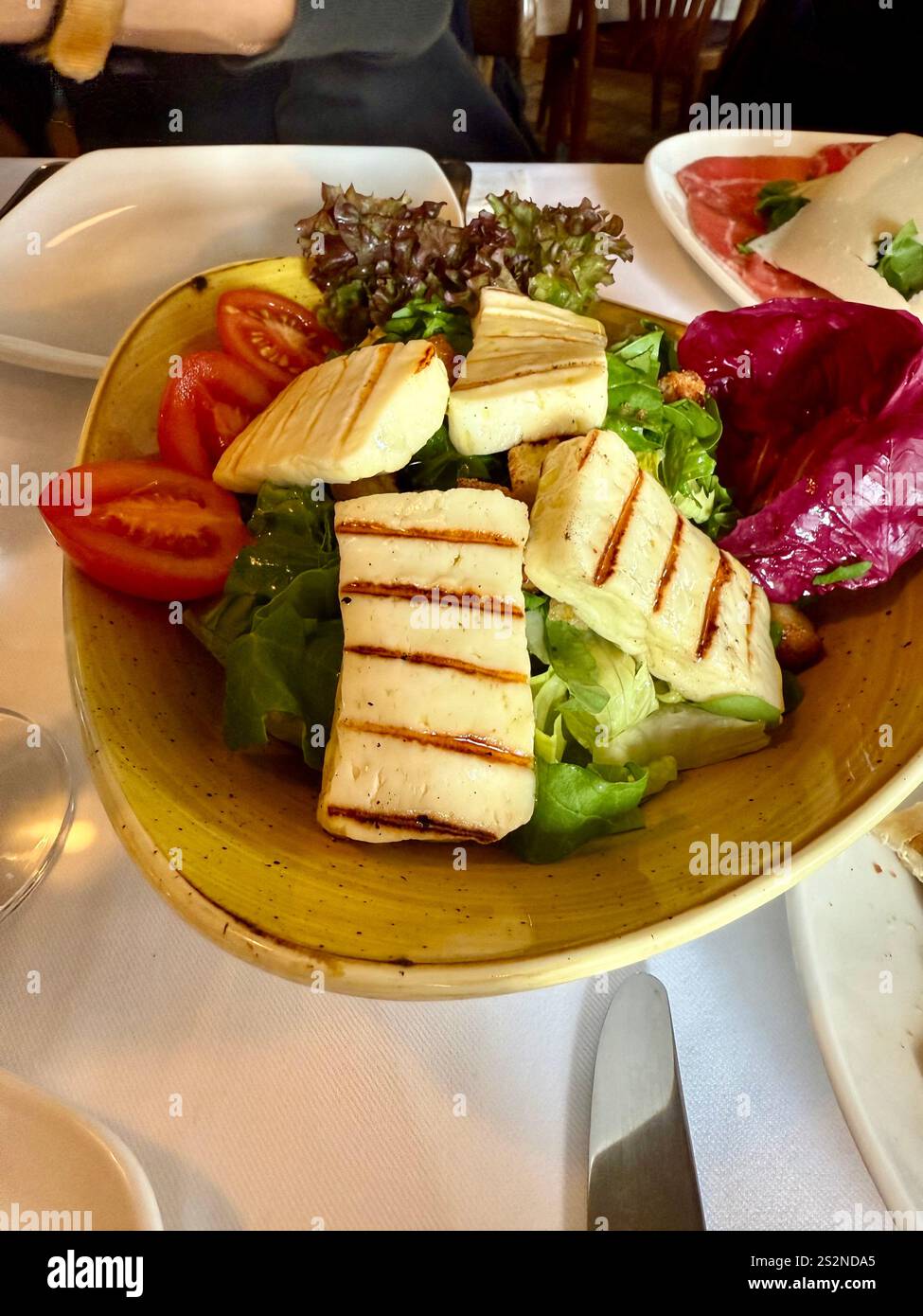 Grilled Halloumi cheese salad served at restaurant. Ready to eat Stock ...