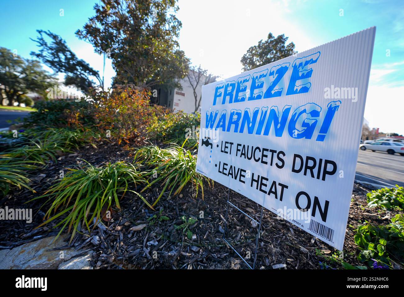 A freeze warning sign is seen outside of an apartment complex ahead of ...