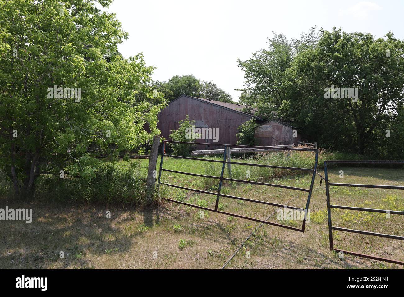abandoned farm buildings behind rickety gates Stock Photo - Alamy