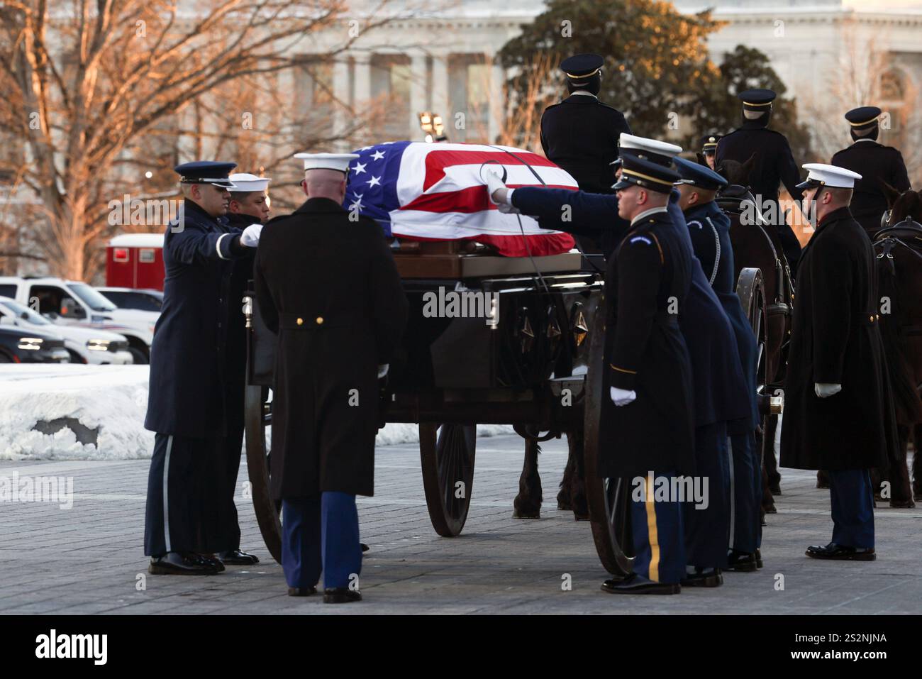 A horse-drawn caisson with the flag-draped casket of former President ...