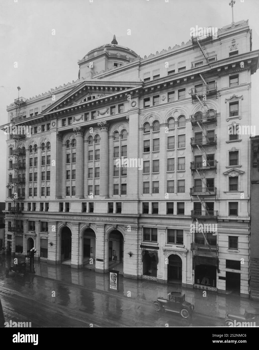 Slightly elevated view of the front of the Trinity auditorium building in Los Angeles ...