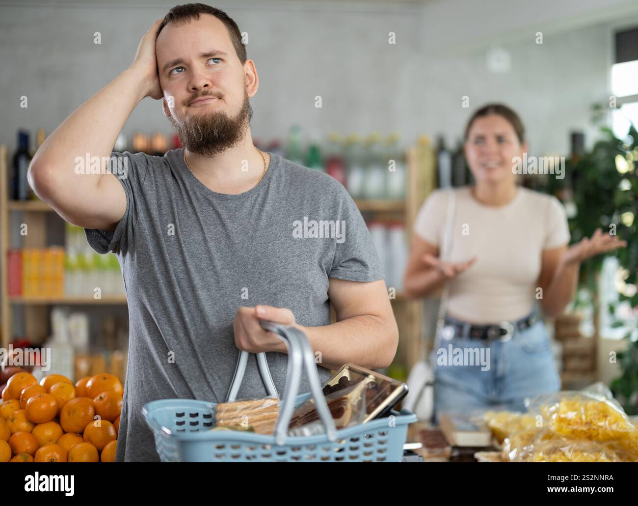 Man and woman quarrel in supermarket - they shout at each other Stock ...