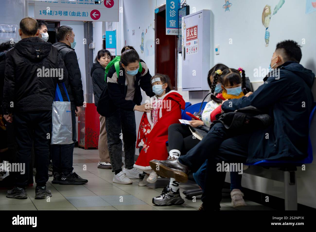 CHONGQING, CHINA - JANUARY 7, 2025 - Parents with their children ...