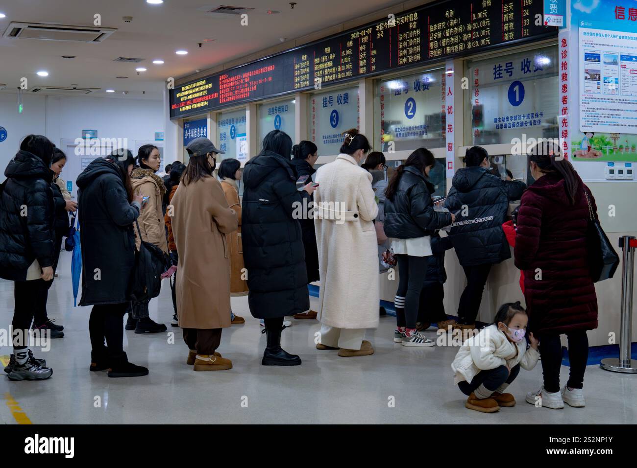 CHONGQING, CHINA - JANUARY 7, 2025 - Parents with their children ...