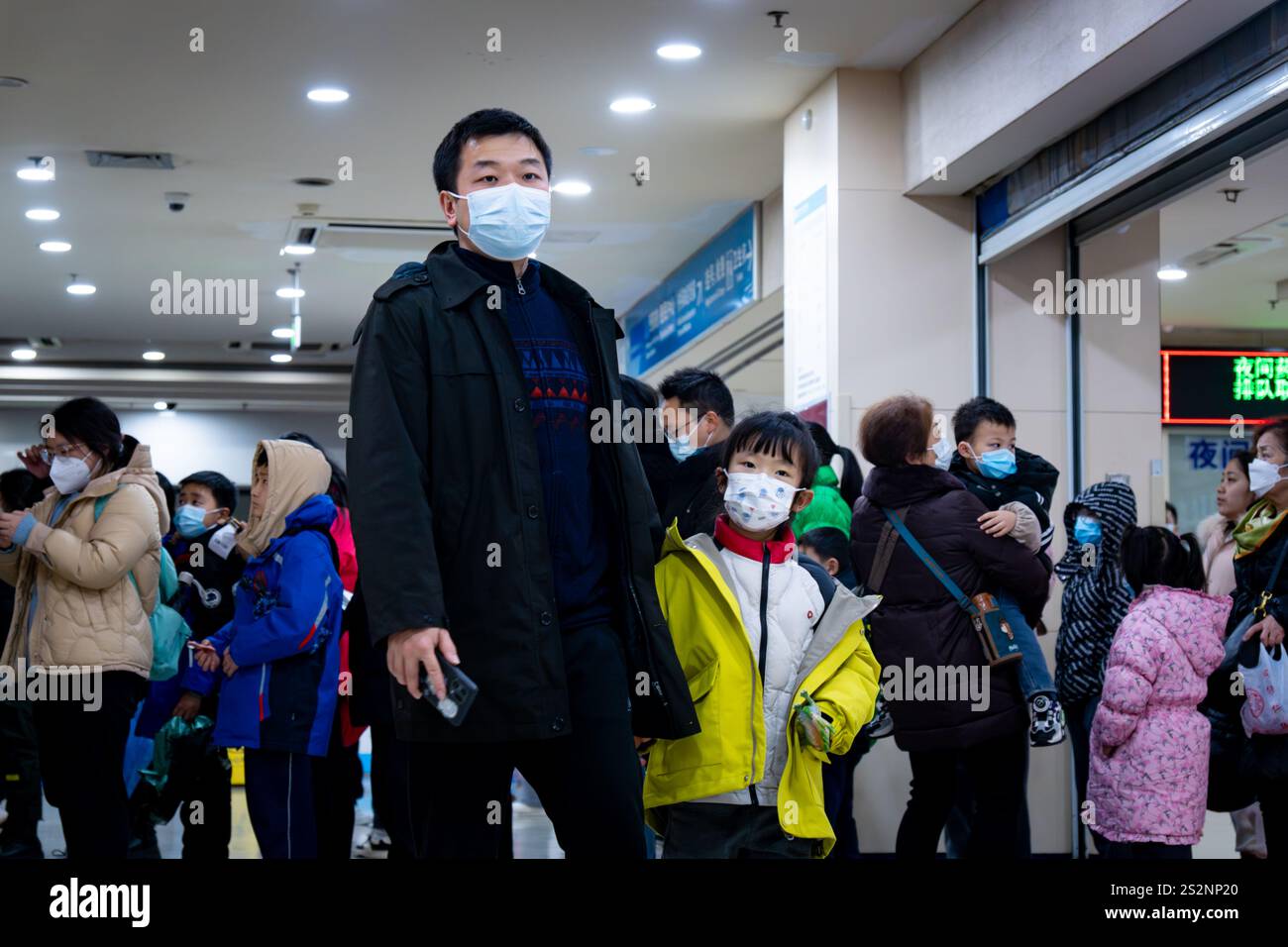 CHONGQING, CHINA - JANUARY 7, 2025 - Parents with their children ...