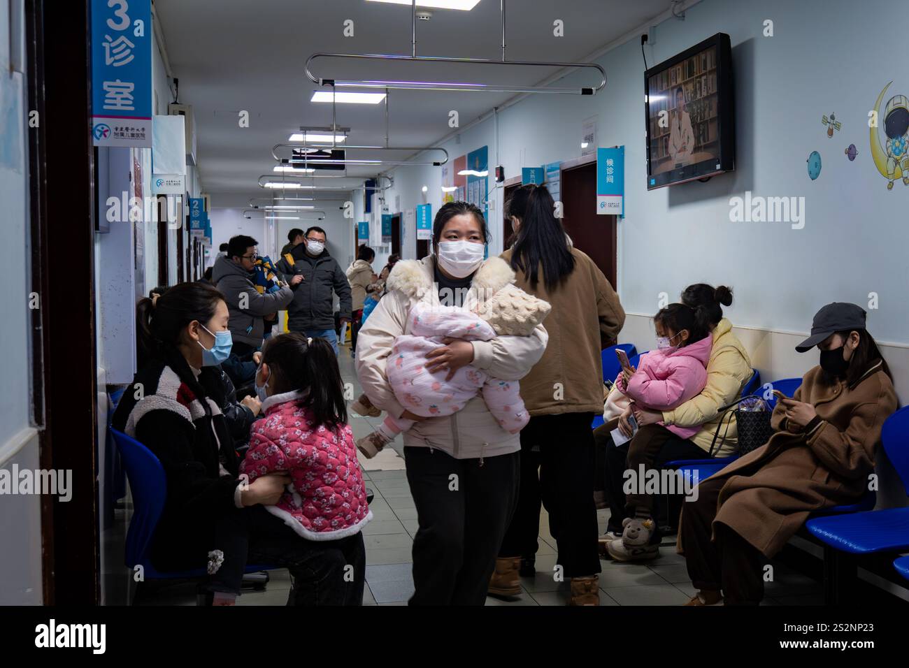 CHONGQING, CHINA - JANUARY 7, 2025 - Parents with their children ...