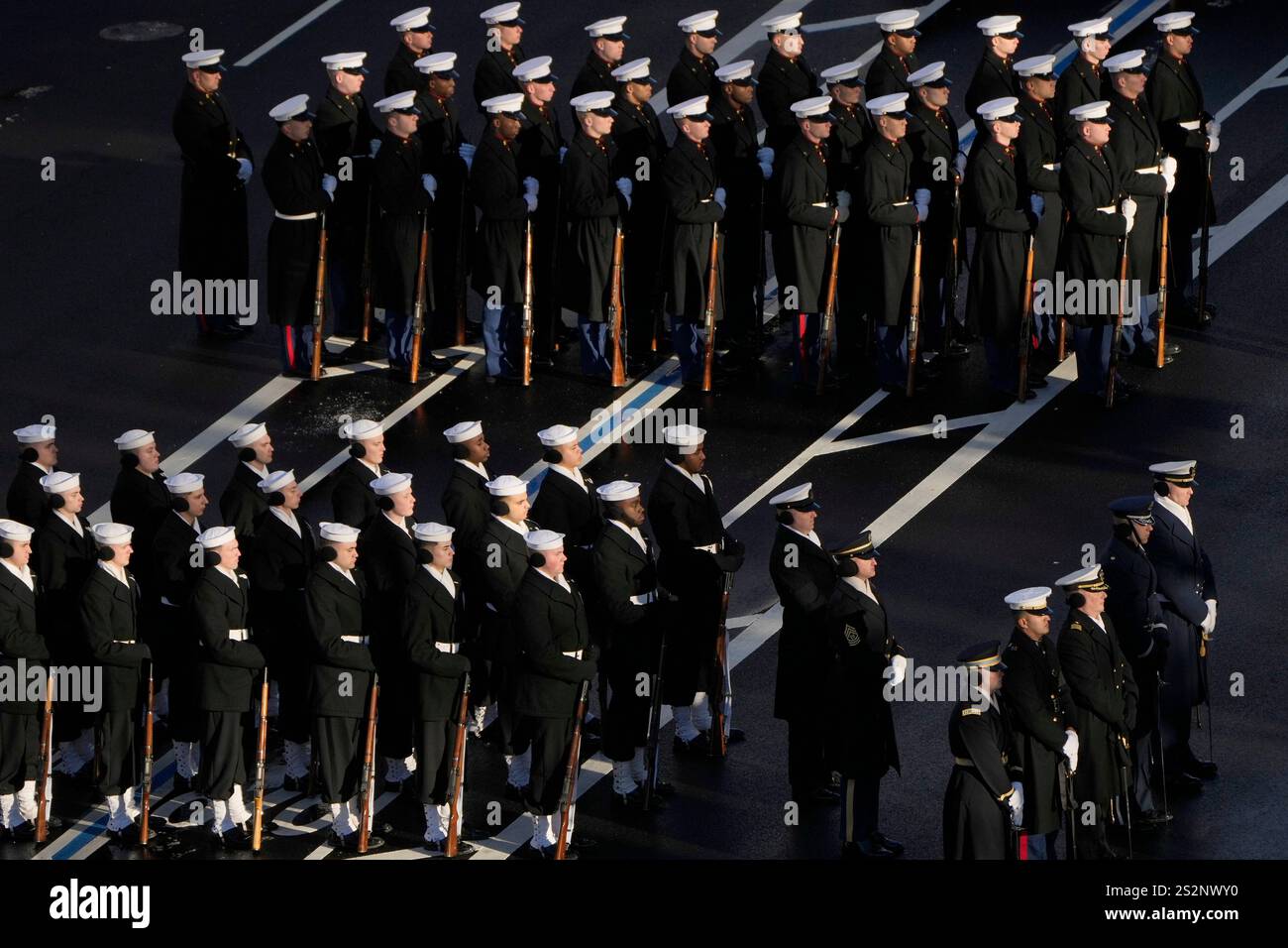 Members of the United States Navy line up to march with the casket of ...