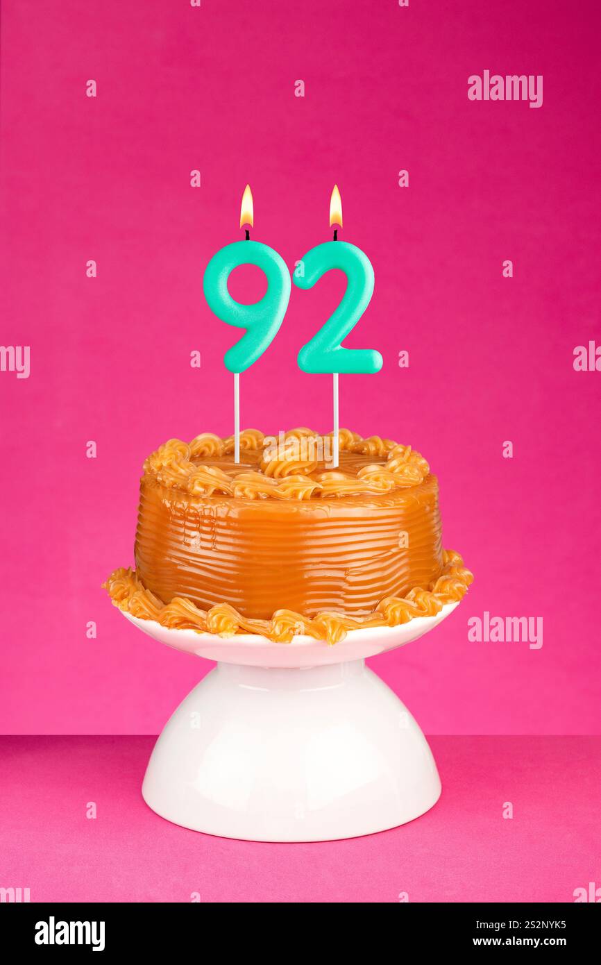 Birthday cake with number 92 candle - Anniversary card on a pink ...