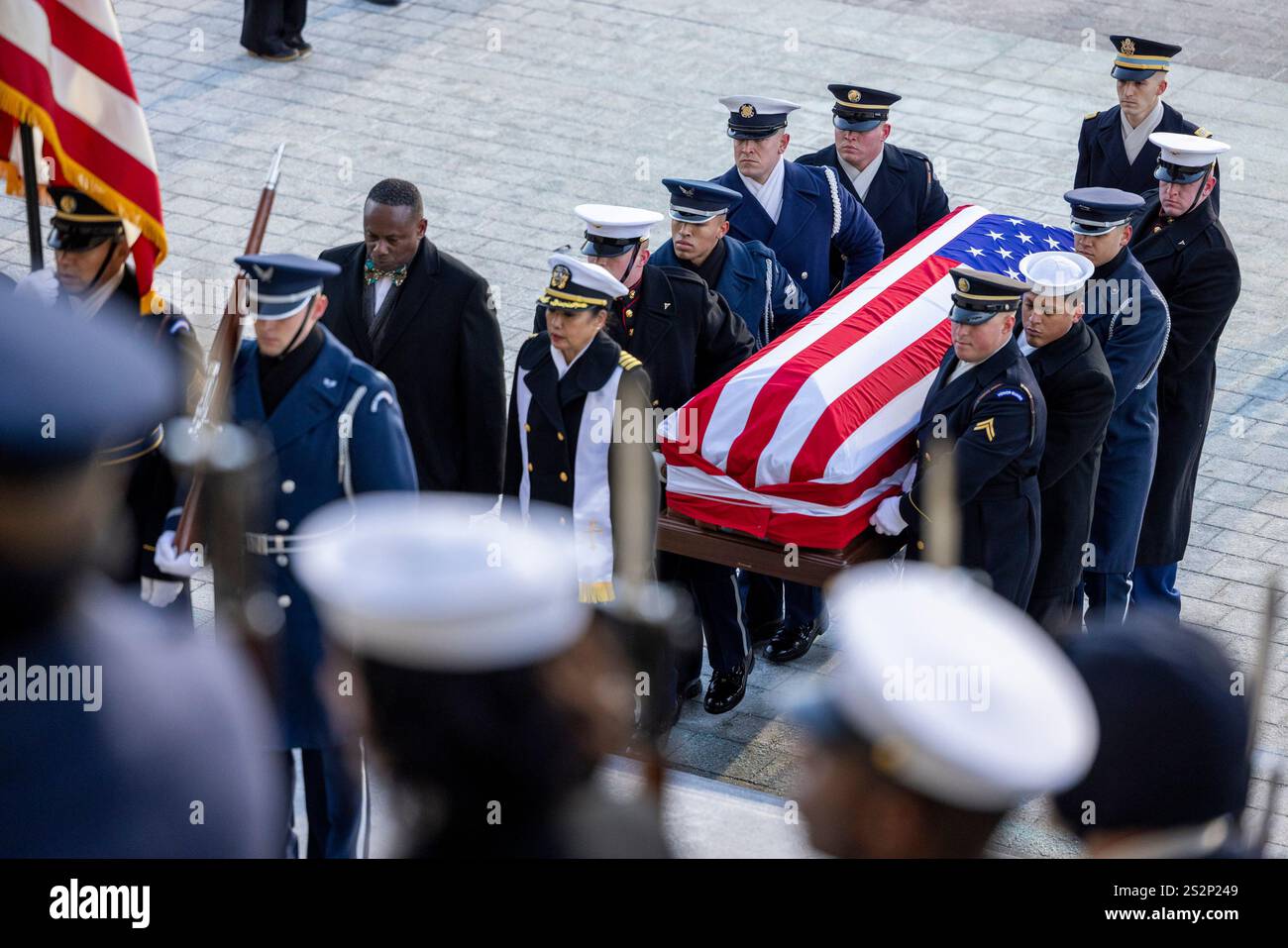 Washington, United States. 07th Jan, 2025. Military pallbearers carry ...