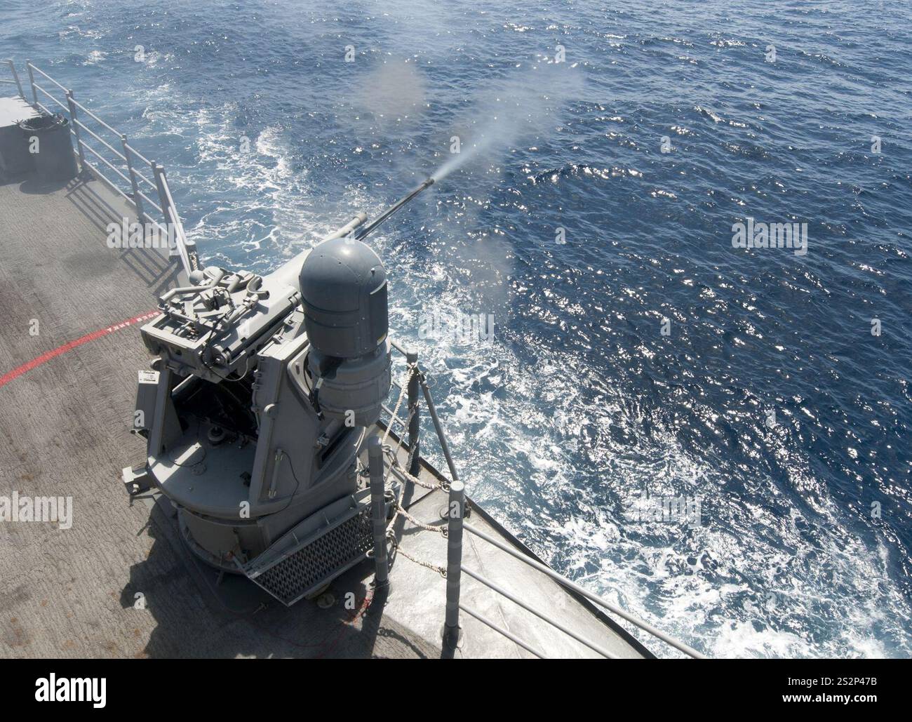 U.S. Navy firing a Mk 38 25mm autocannon by remote control Stock Photo - Alamy