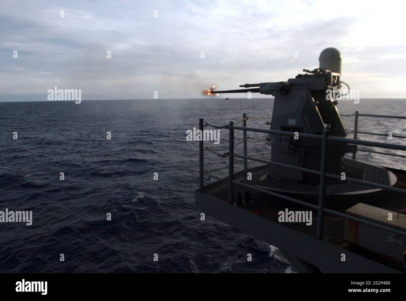 U.S. Navy USS Boxer firing a Mk 38 25mm autocannon by remote control ...