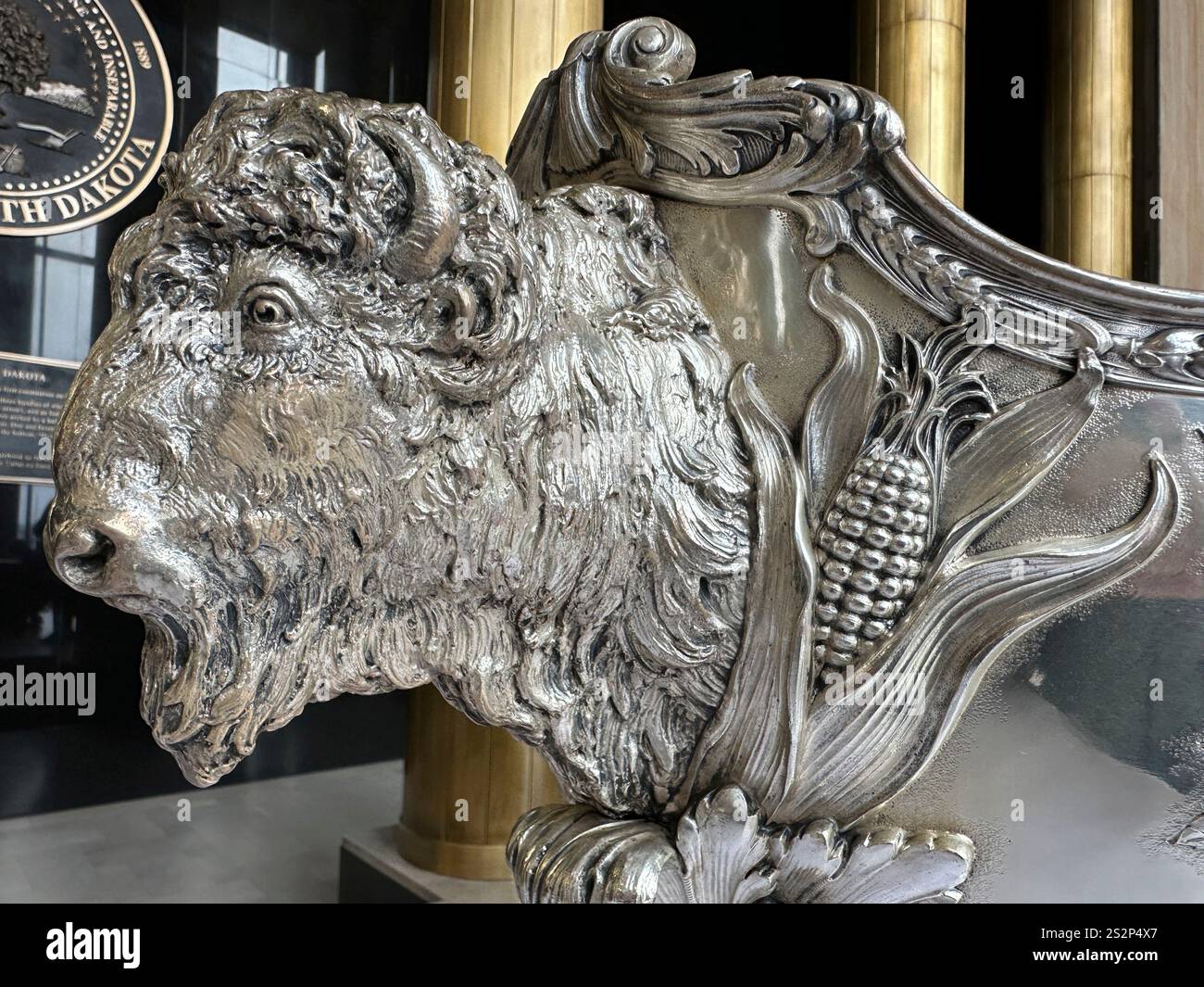 The punchbowl of the USS North Dakota silver service shows details of a ...
