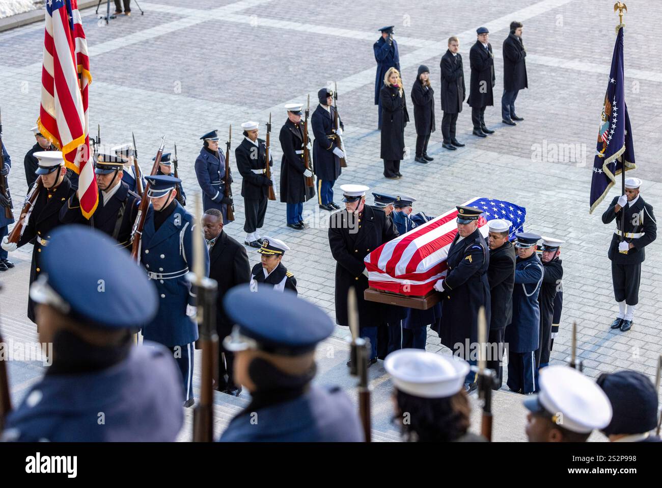 A joint services body bearer team moves the casket of former President ...