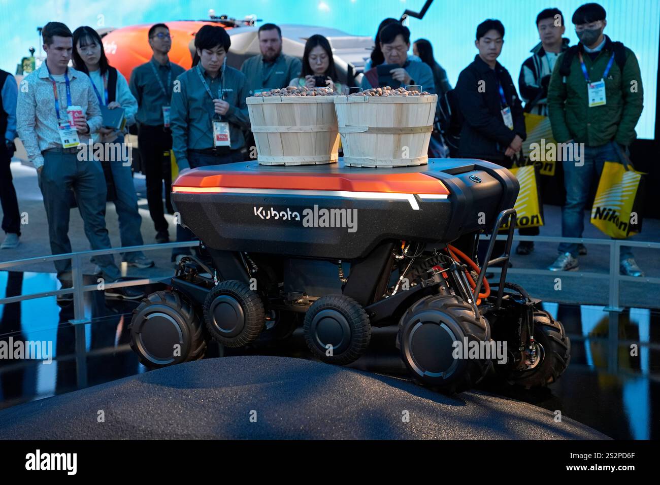 People view a demonstration of the KATR robot designed to work in agriculture and construction ...