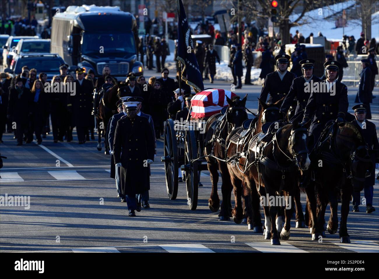 As members of the Carter family follow, the casket containing the ...